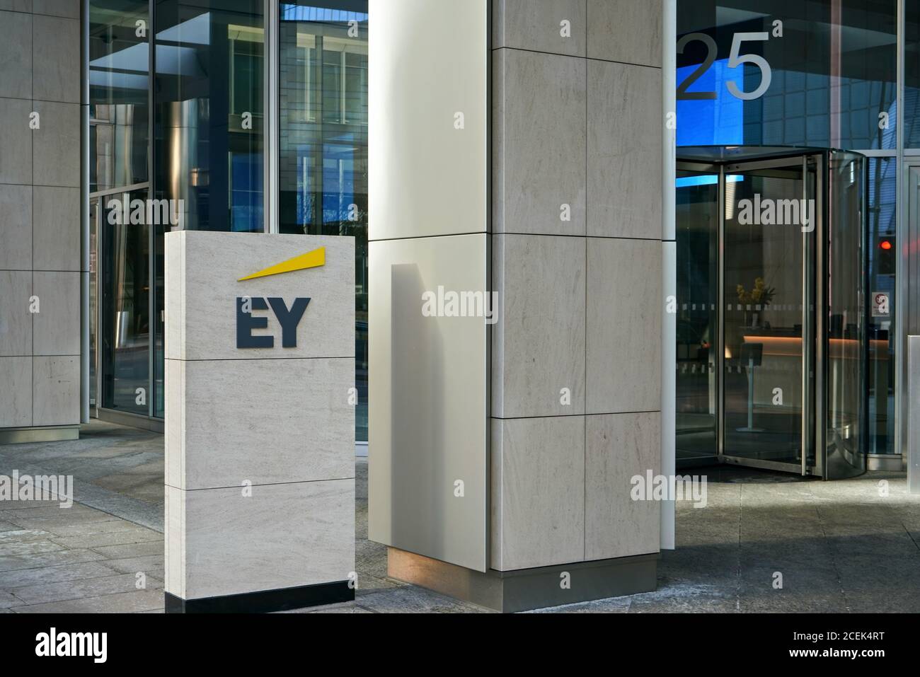 London, United Kingdom - February 03, 2019: Blue and yellow EY signage ...