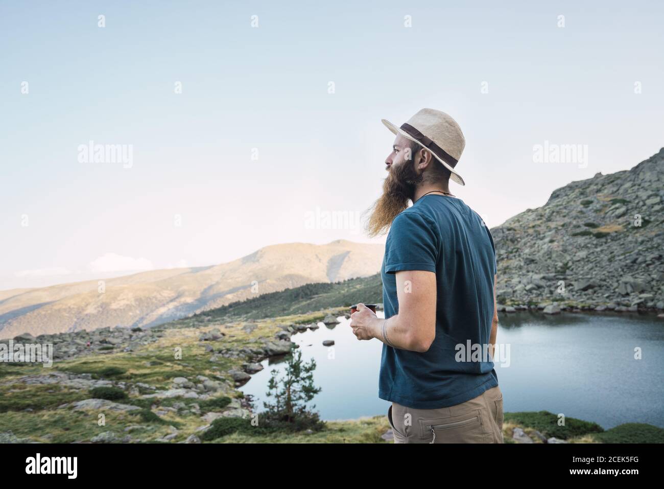 Man standing by lake hi-res stock photography and images - Alamy