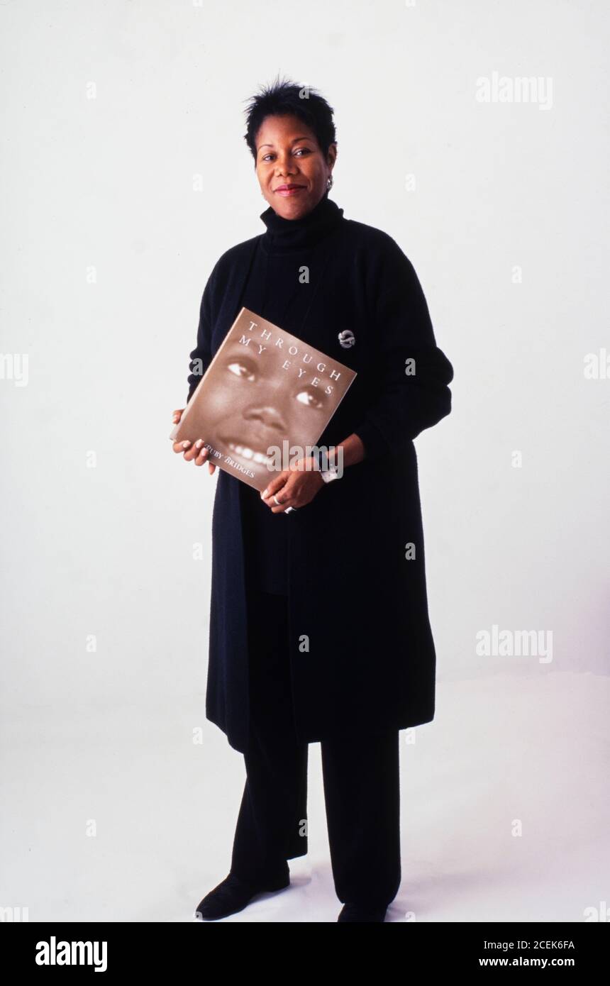 Ruby Bridges holding a print of the Norman Rockwell painting The ...