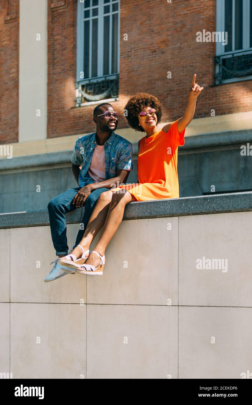 Black couple sitting hi-res stock photography and images - Alamy