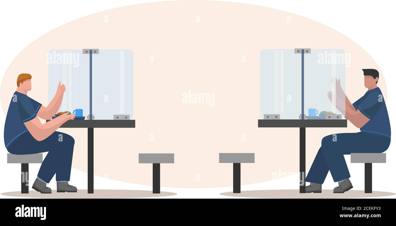 Social distancing at lunch time at the office dinner room: two workers ...