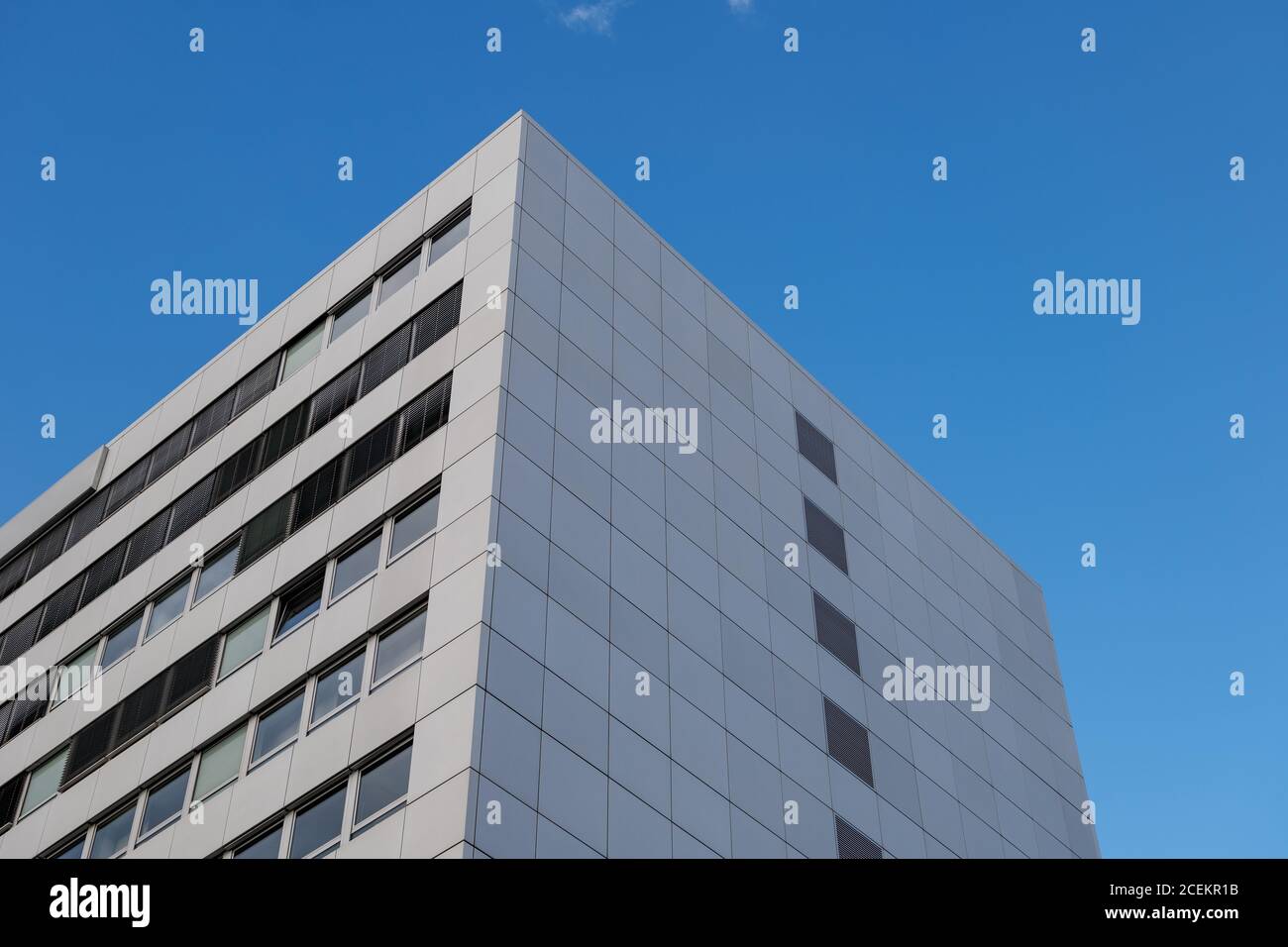 Close up detail at corner of white cladding facade with rectangular ...
