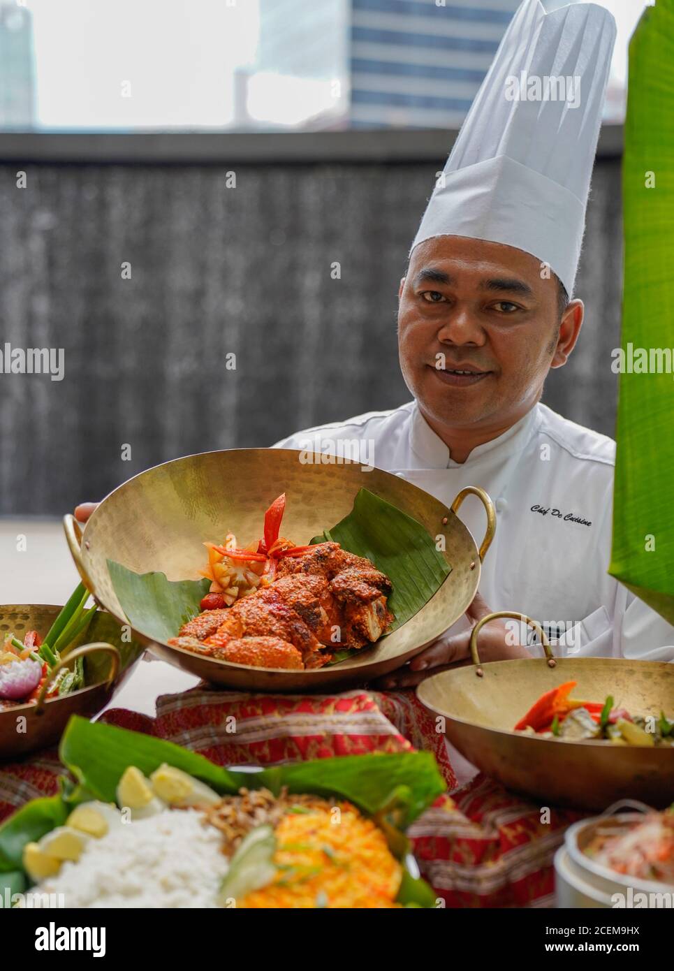 Asian Chef portrait with lovely Food dishes Stock Photo - Alamy