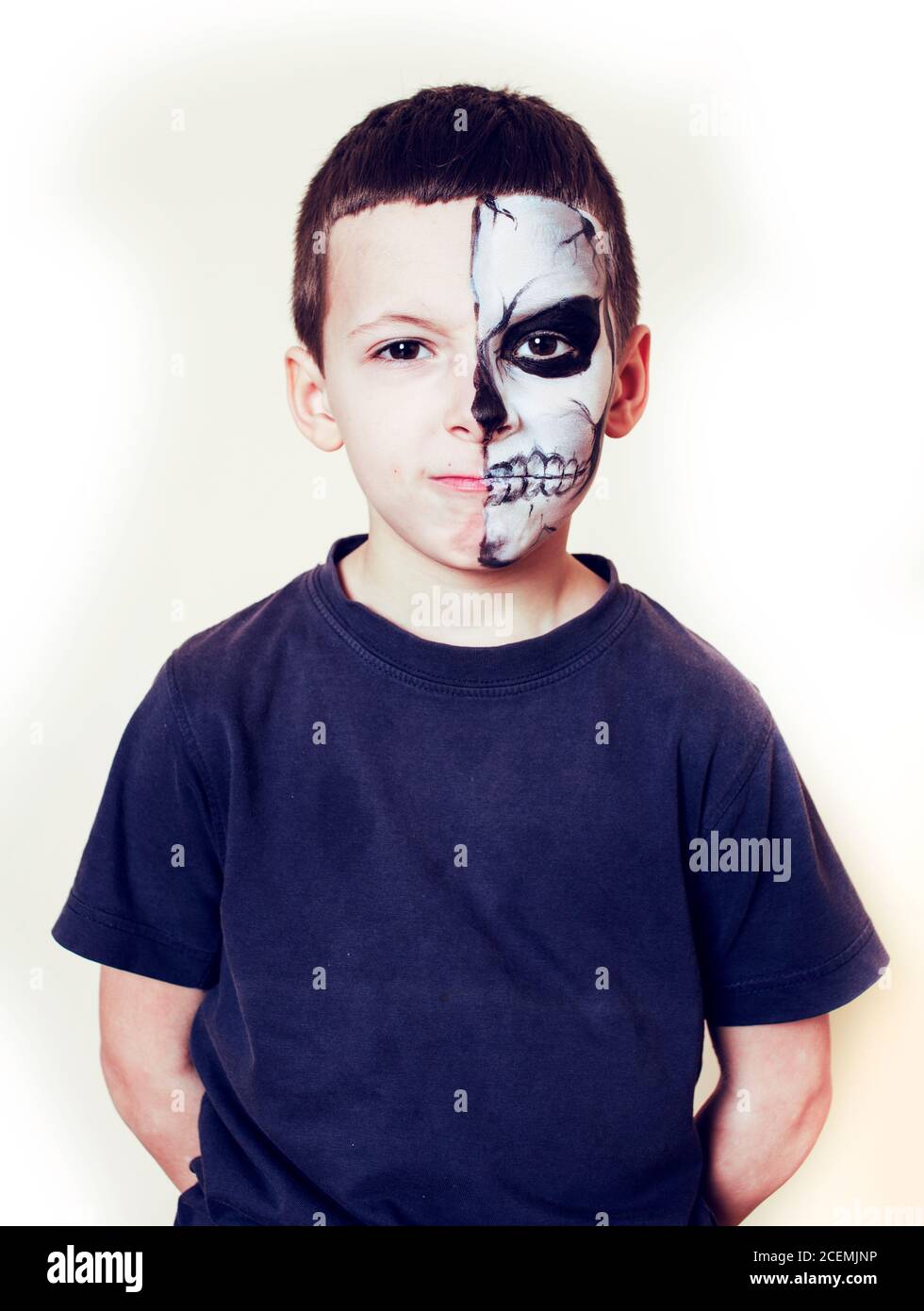 little cute boy with facepaint like skeleton to celebrate halloween ...