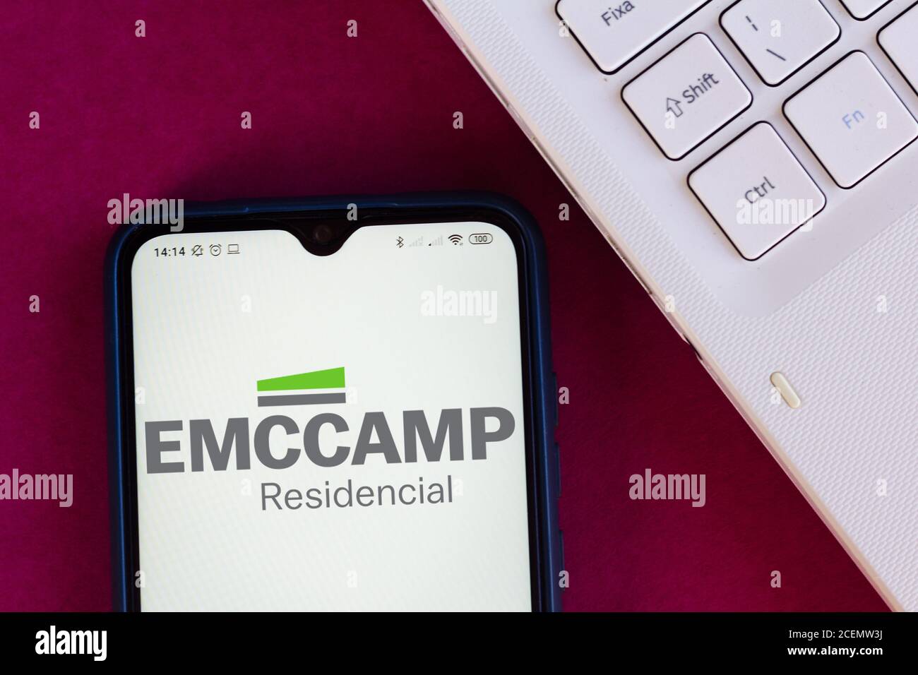 In this photo illustration the Emccamp Residencial logo displayed on a ...