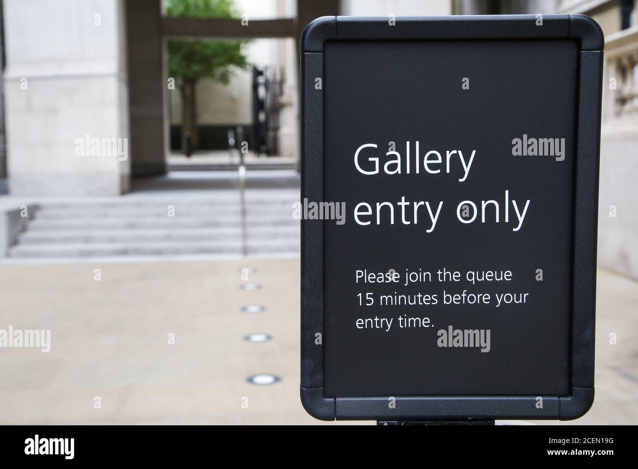 A "Gallery entry only' sign on display outside a gallery in central ...