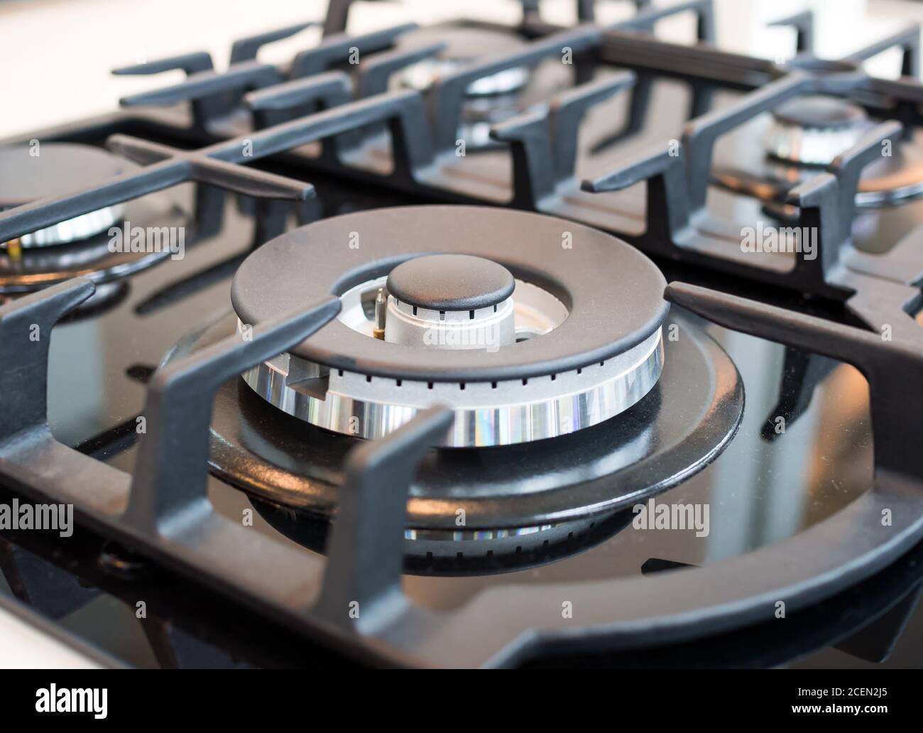 Massive burner of a modern gas stove Stock Photo - Alamy