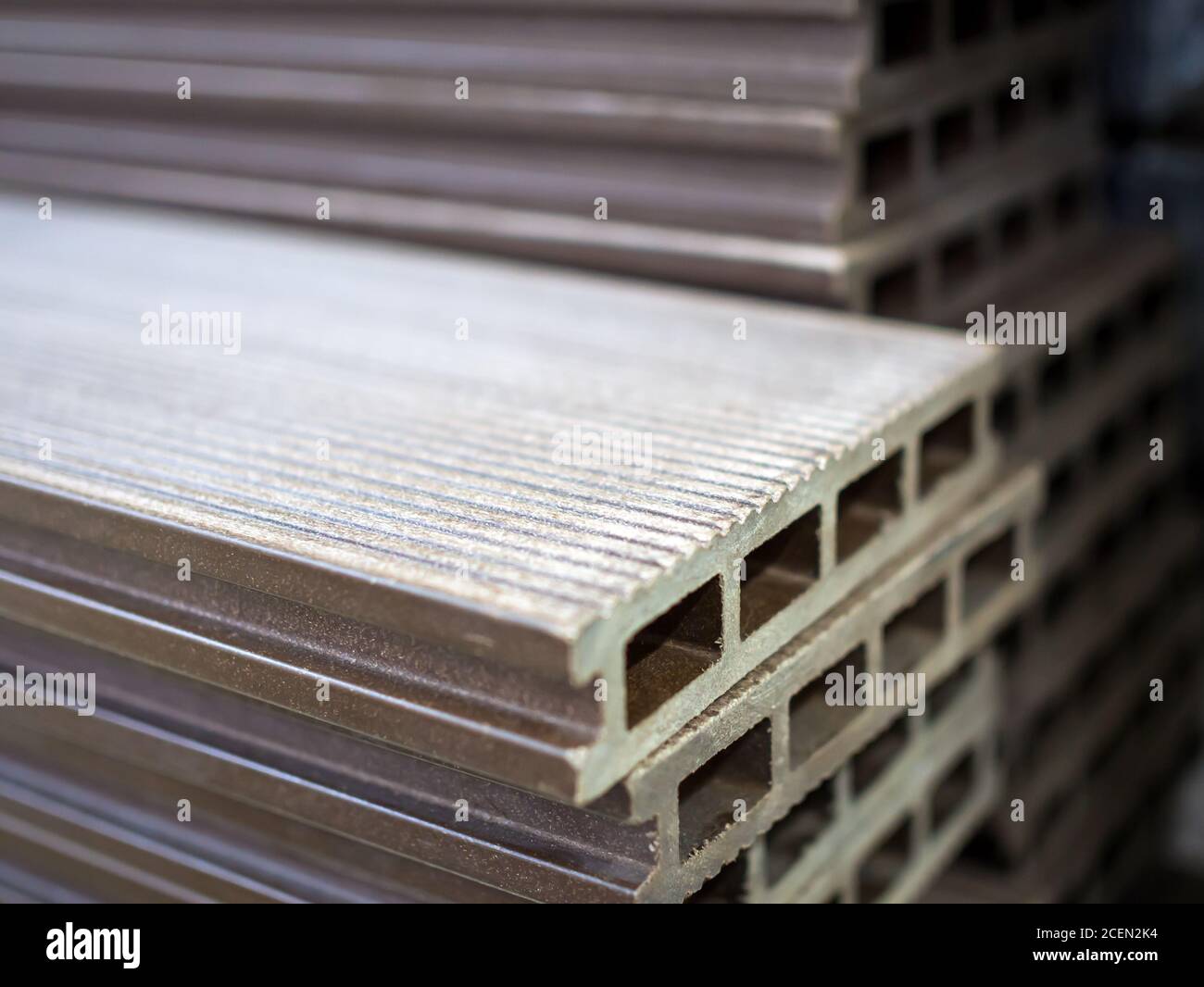 Polymer decking board stacked in a building materials warehouse Stock ...