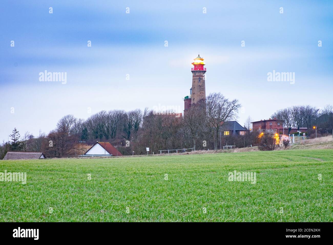 In rainy night shinning lighthouse Cap Arkona at the northern tip of ...