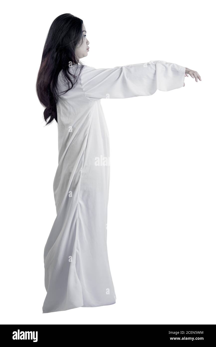 Scary ghost woman standing isolated over white background. Halloween ...