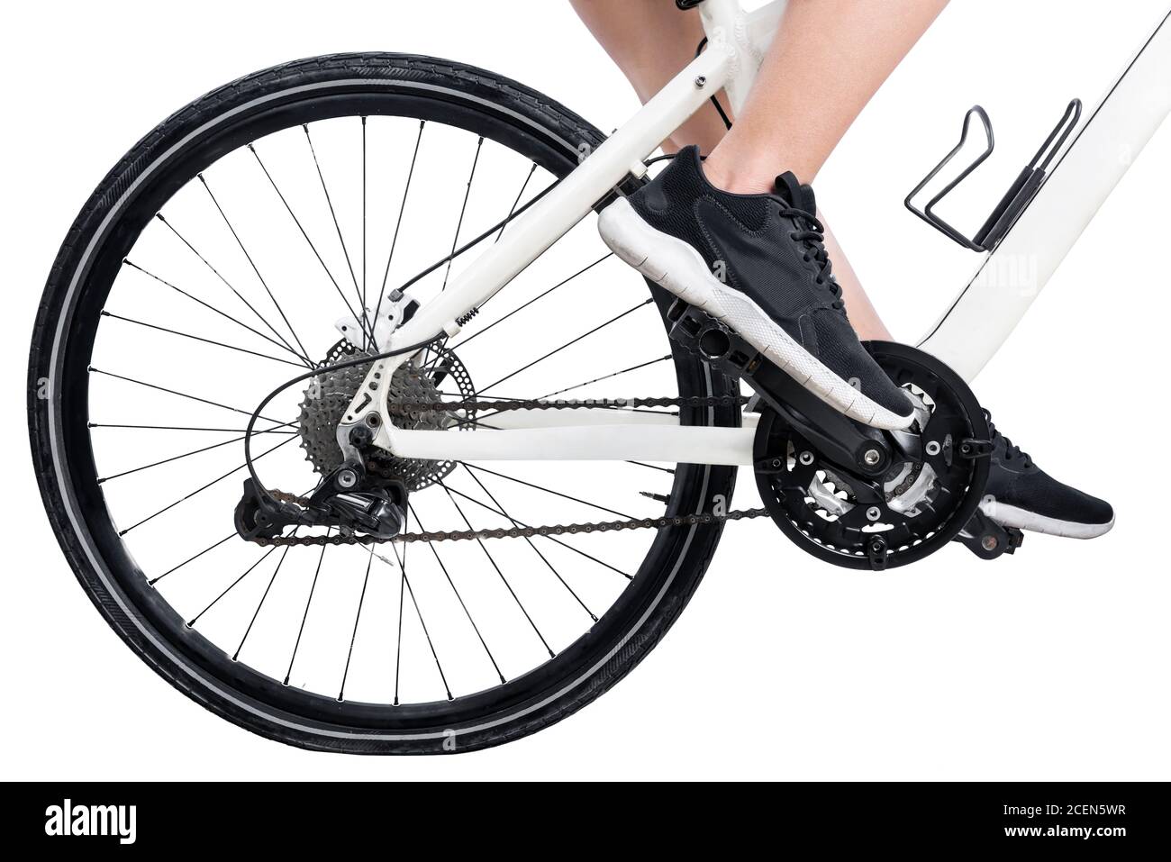 Side view of a woman riding a bicycle isolated over white background ...