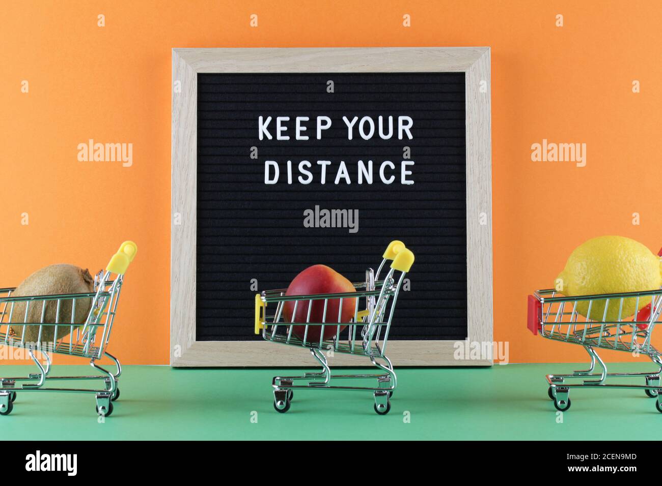 Keep Your Distance Warning Sign with basket with fruit located at ...