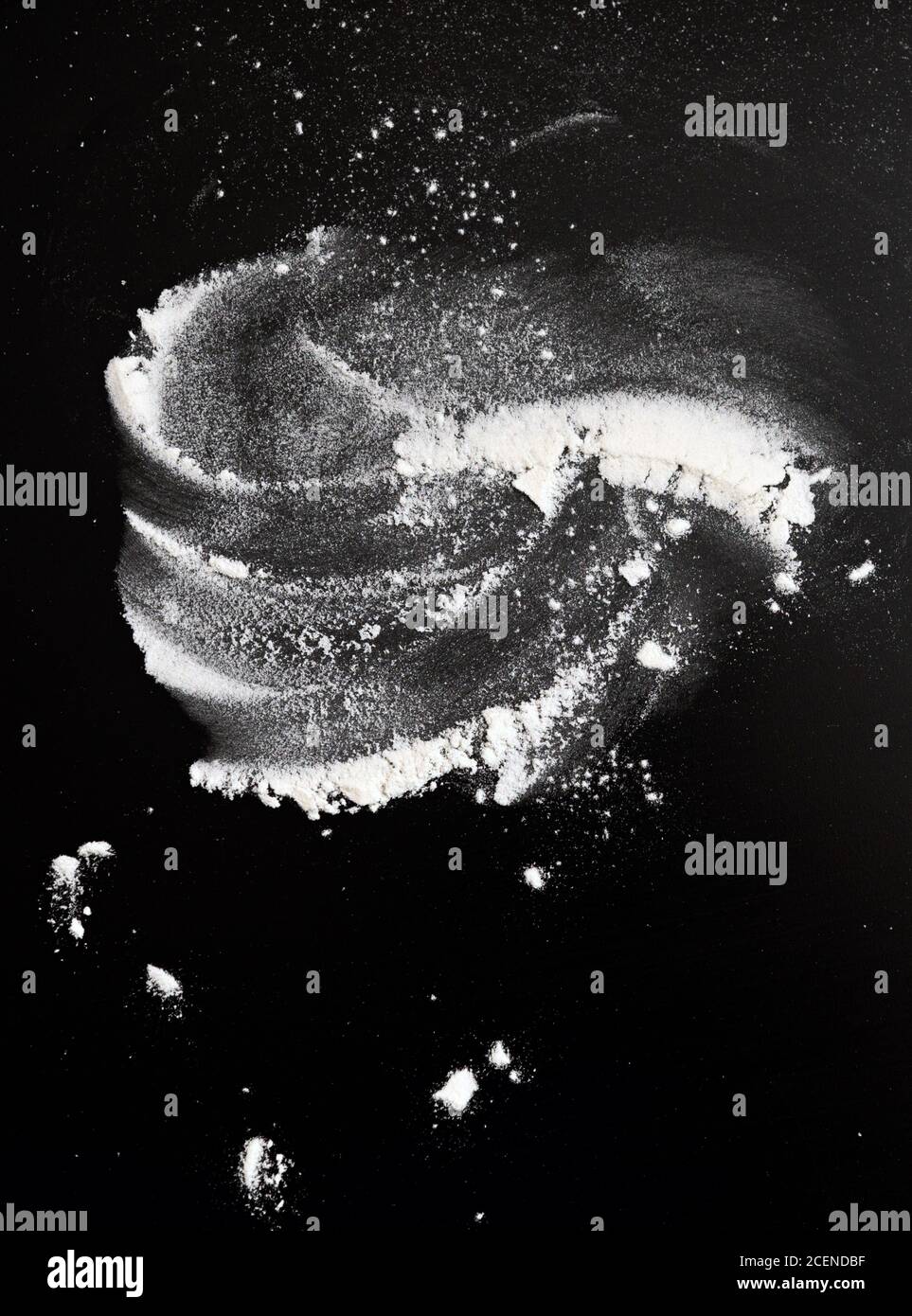 Flour on black background Stock Photo - Alamy