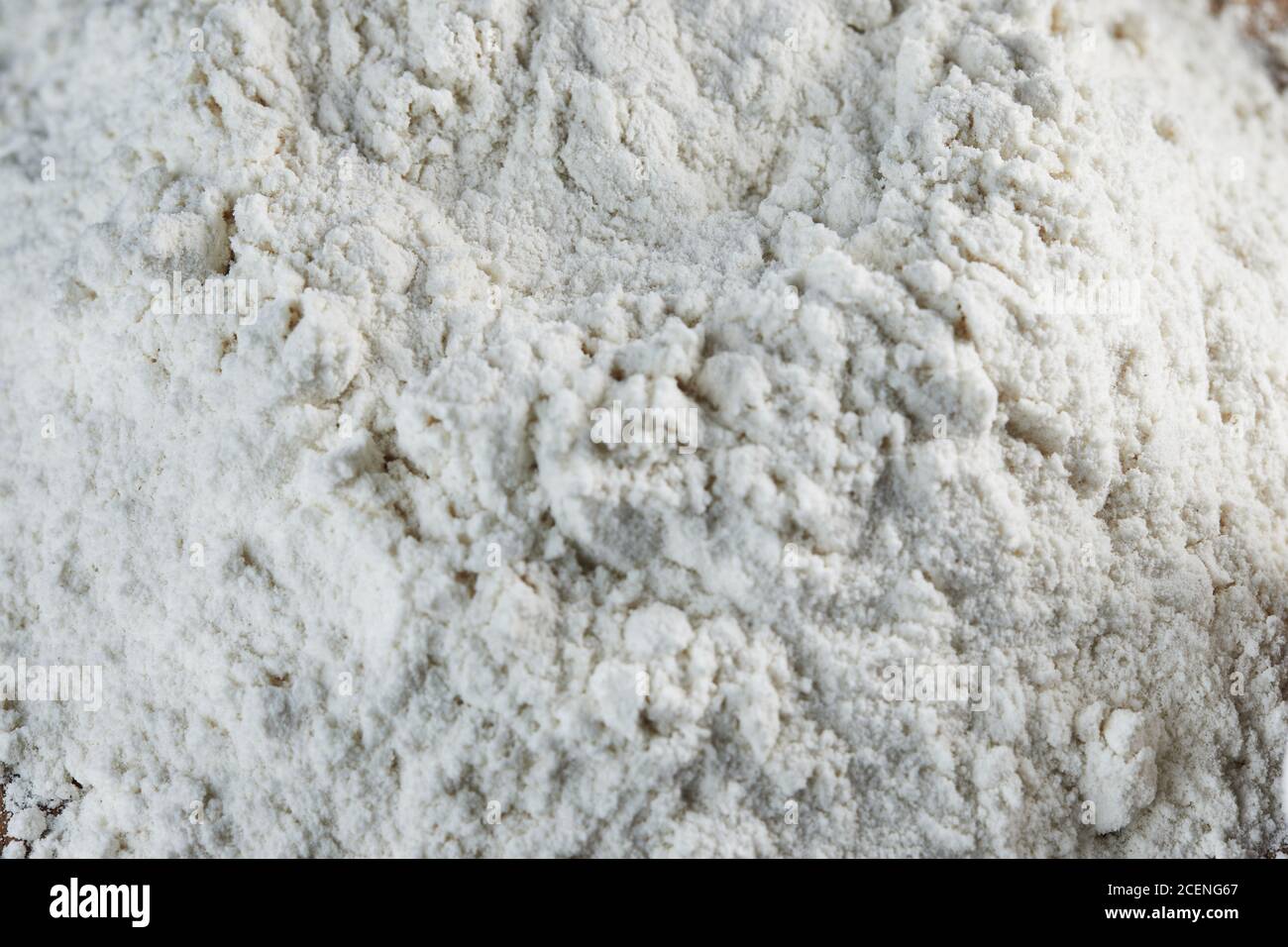 Flour lying in a slide with beautiful illumination, background texture ...