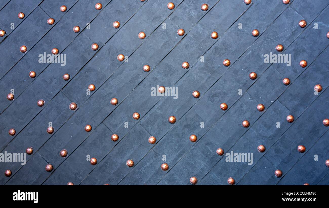 Old metal door with rivets Stock Photo - Alamy
