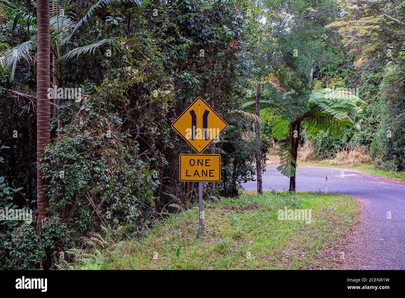 One lane ahead road sign indicating narrow access for passing through a ...