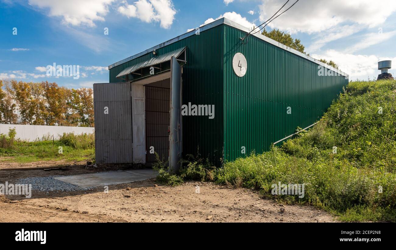 Facade of a metal warehouse, commercial building for storage of goods ...