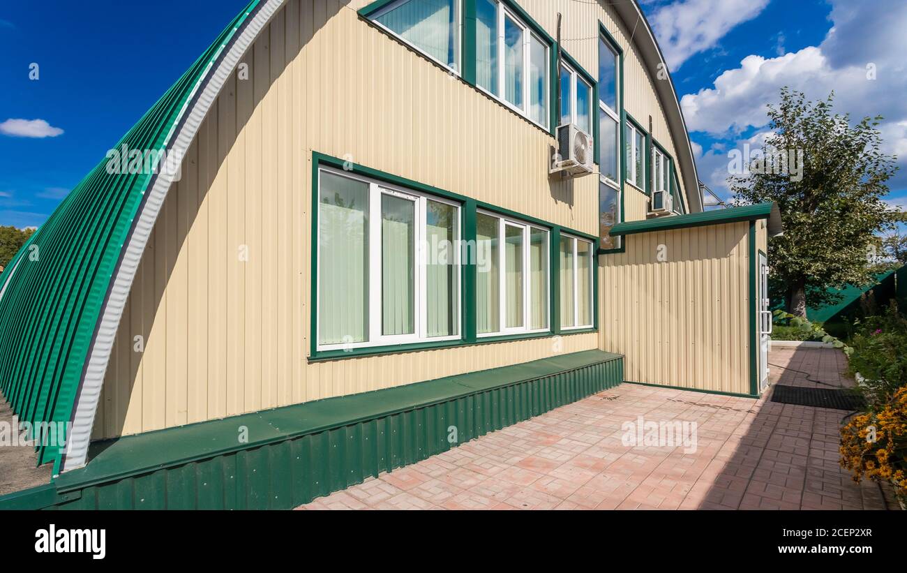 Metal warehouse with sheet metal cladding with street lights ...
