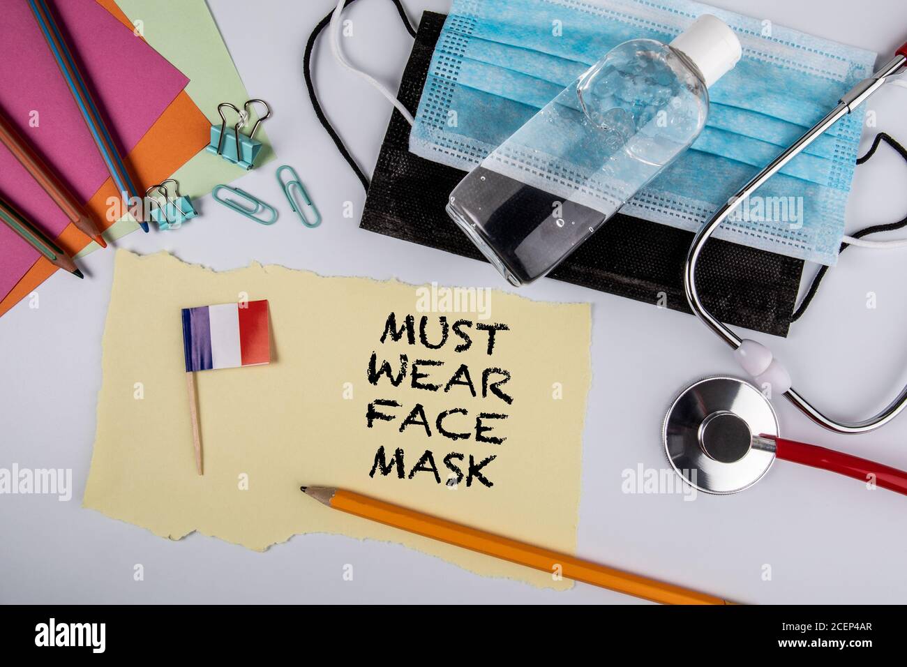 Must wear face mask. French flag and note sheet. Face mask and hand ...