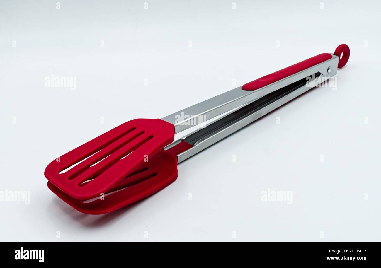 Piece food tong isolated on white background Stock Photo - Alamy