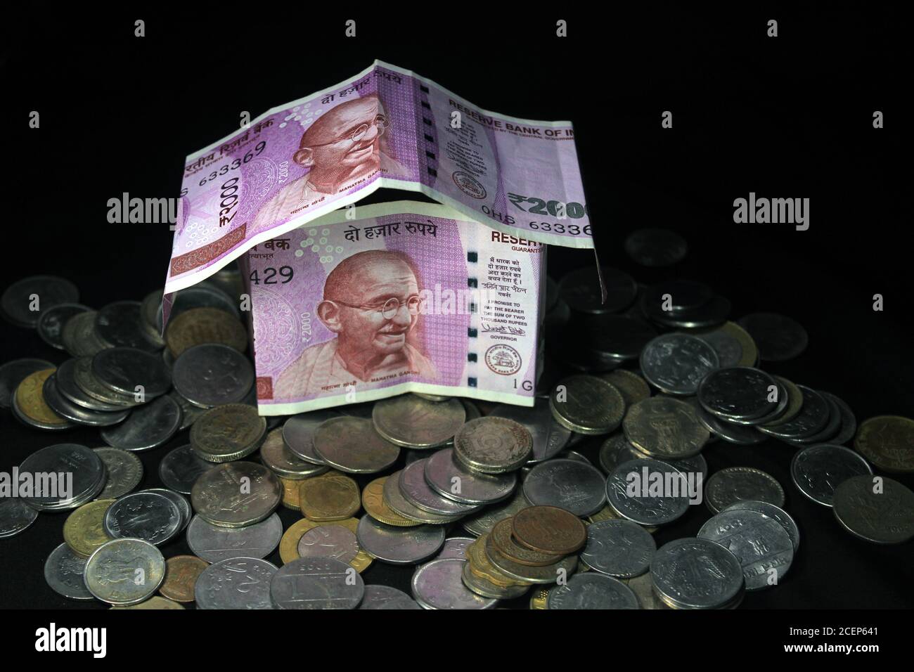 Concept of Indian rupee bank notes folded into the shape of a simple ...