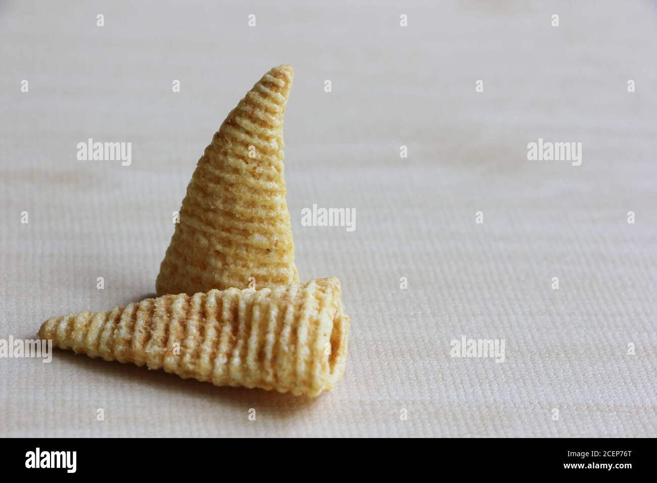 Cone of Corns Snack. Yellow, puffed Stock Photo - Alamy