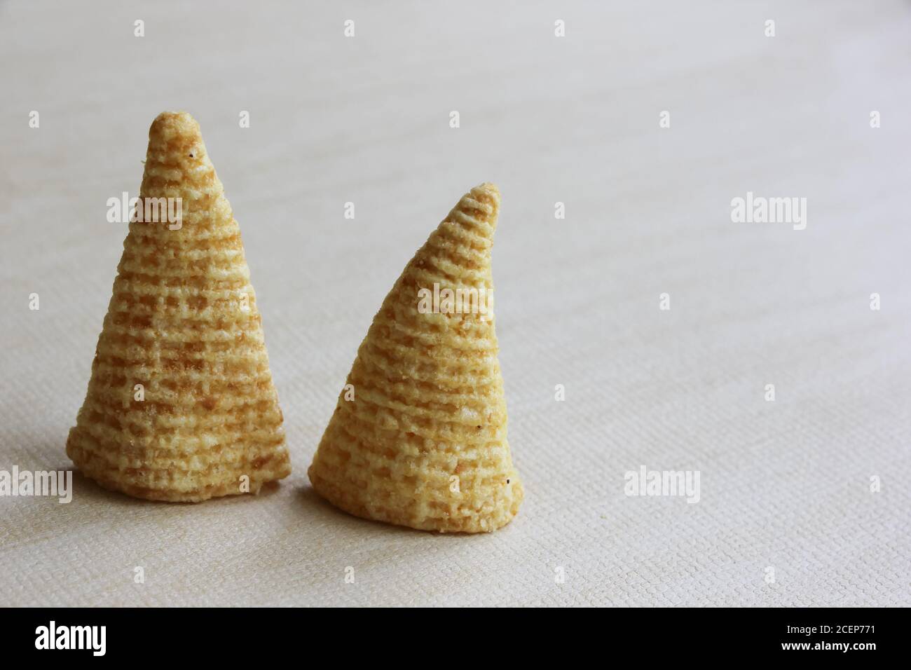 Cone of Corns Snack. Yellow, puffed Stock Photo - Alamy