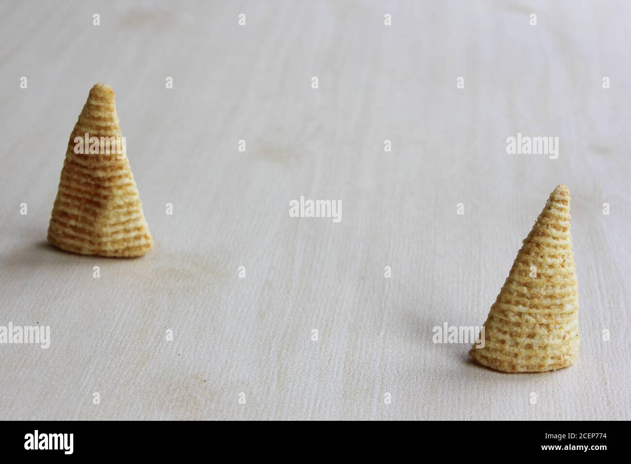Cone of Corns Snack. Yellow, puffed Stock Photo - Alamy