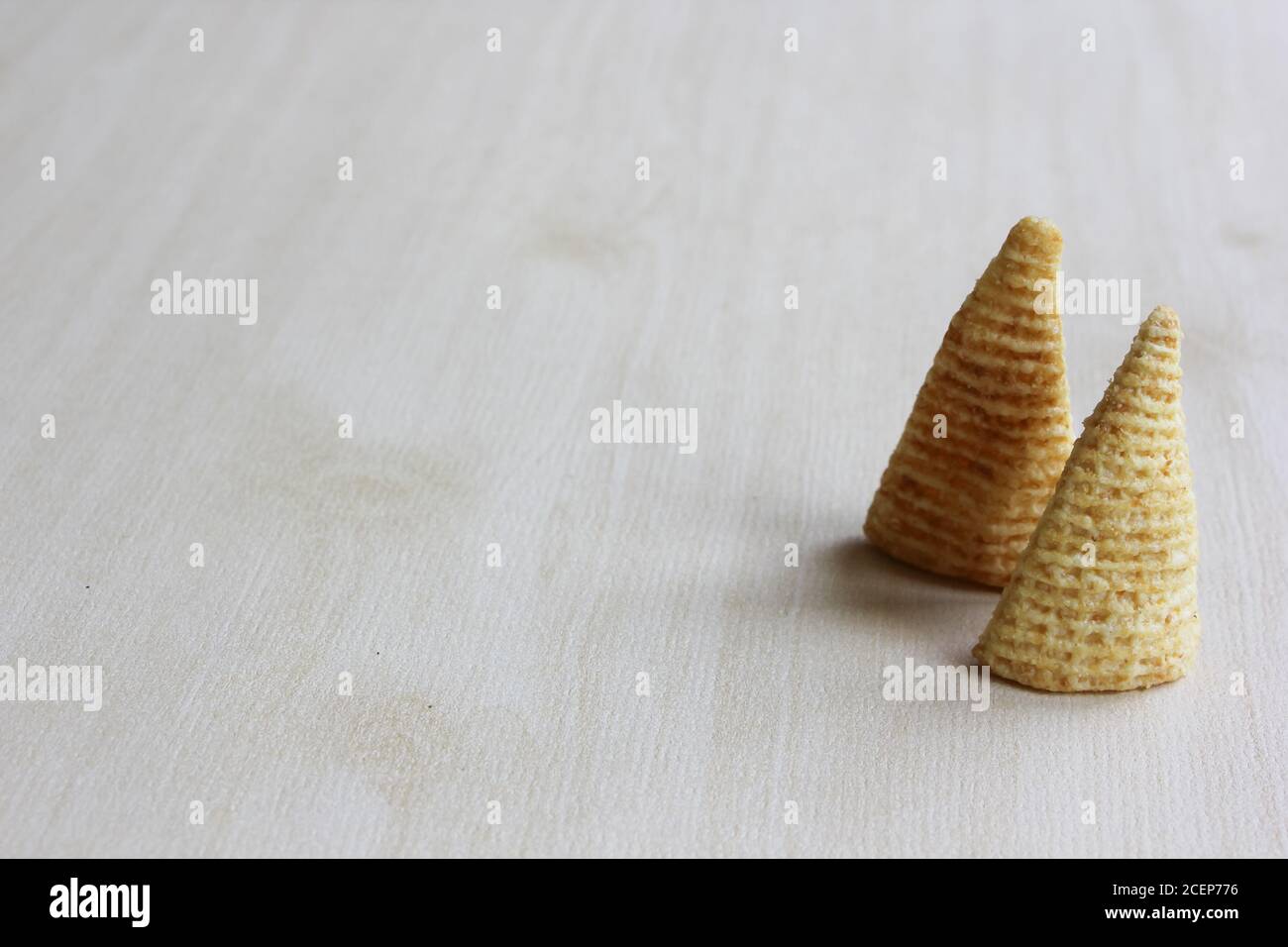Cone of Corns Snack. Yellow, puffed Stock Photo - Alamy
