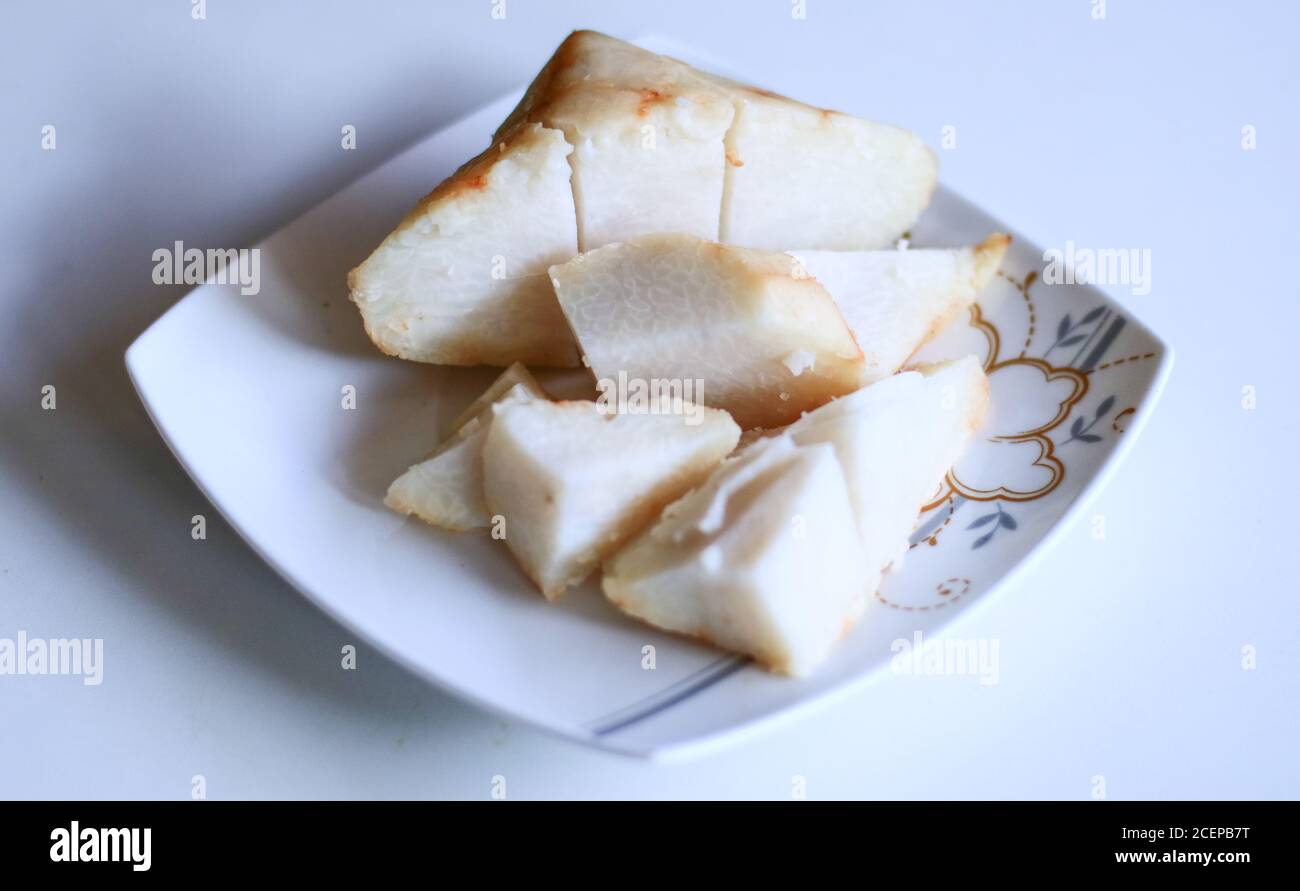 Sliced ketupat on a plate. Ketupat is traditional rice cake from ...
