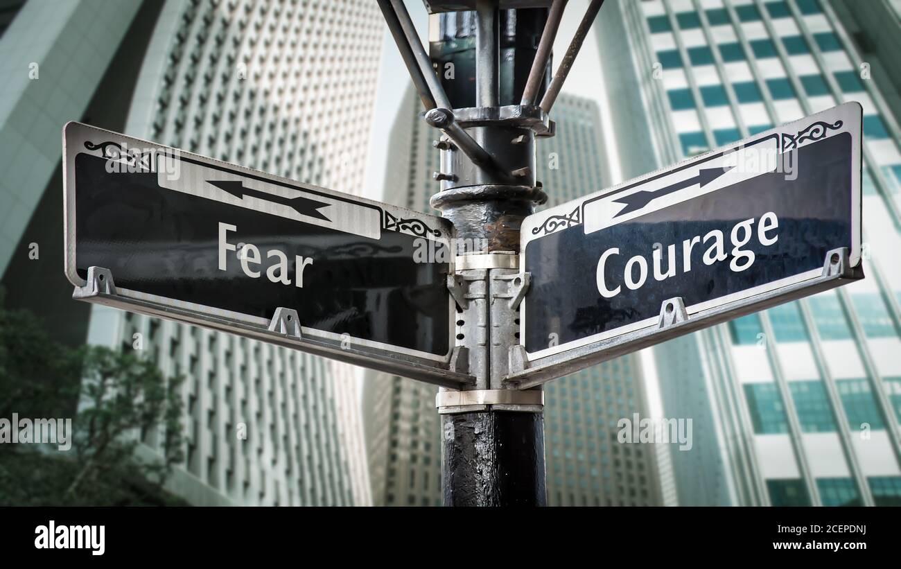 Street Sign the Direction Way to Courage versus Fear Stock Photo - Alamy