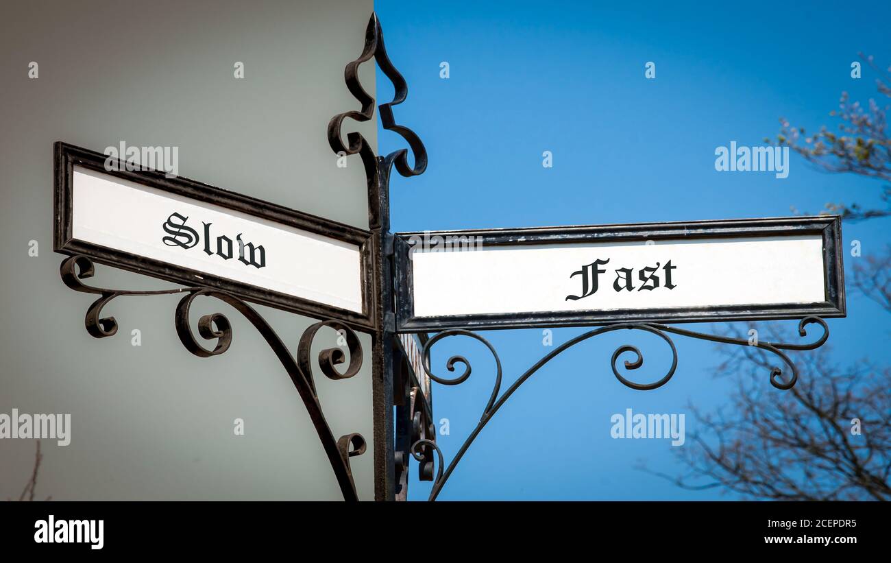 Street Sign the Direction Way to Fast versus Slow Stock Photo - Alamy