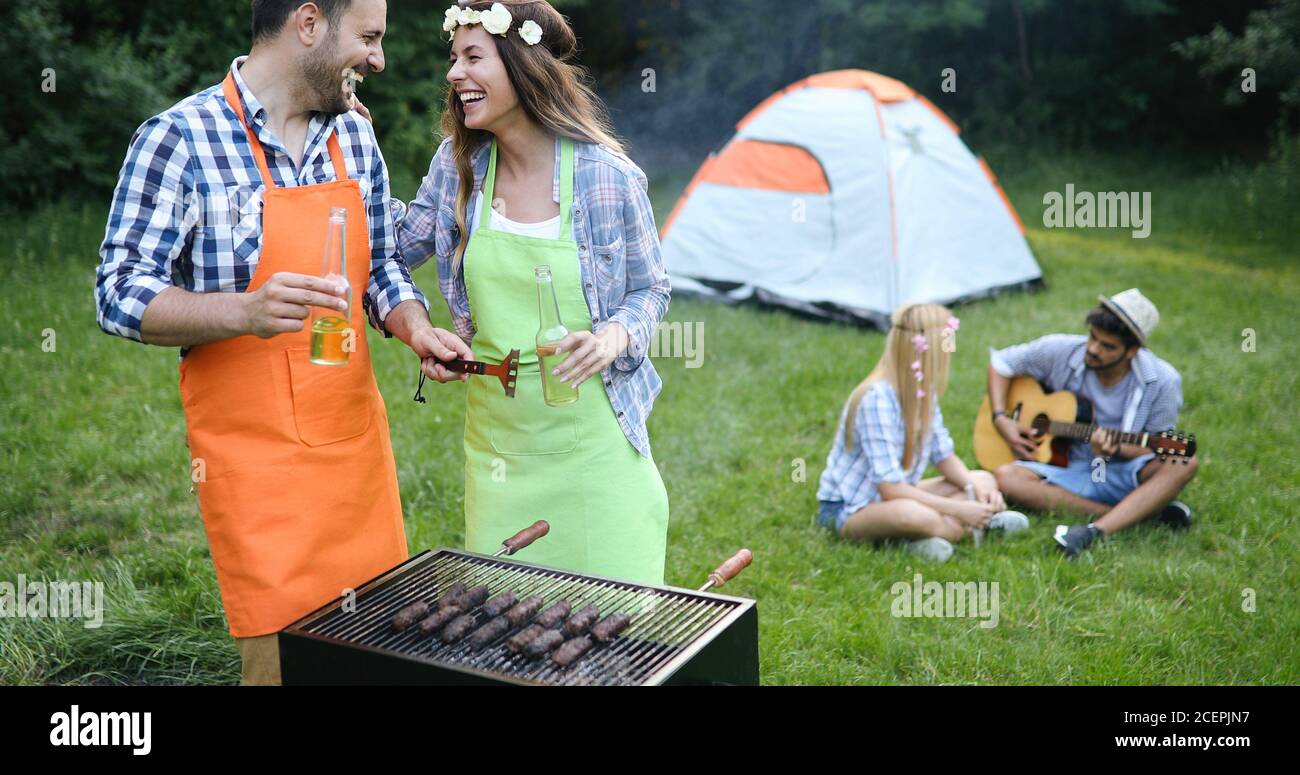 Friends enjoying bbq party and having fun togehter Stock Photo - Alamy