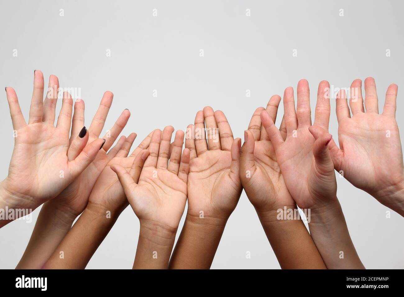 Hands kids up multiracial hi-res stock photography and images - Alamy