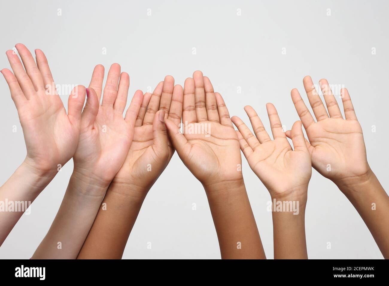 Hands kids up multiracial hi-res stock photography and images - Alamy