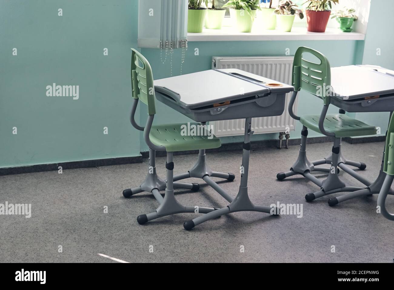 Moderd school smart classroom without young student.View of elementary ...