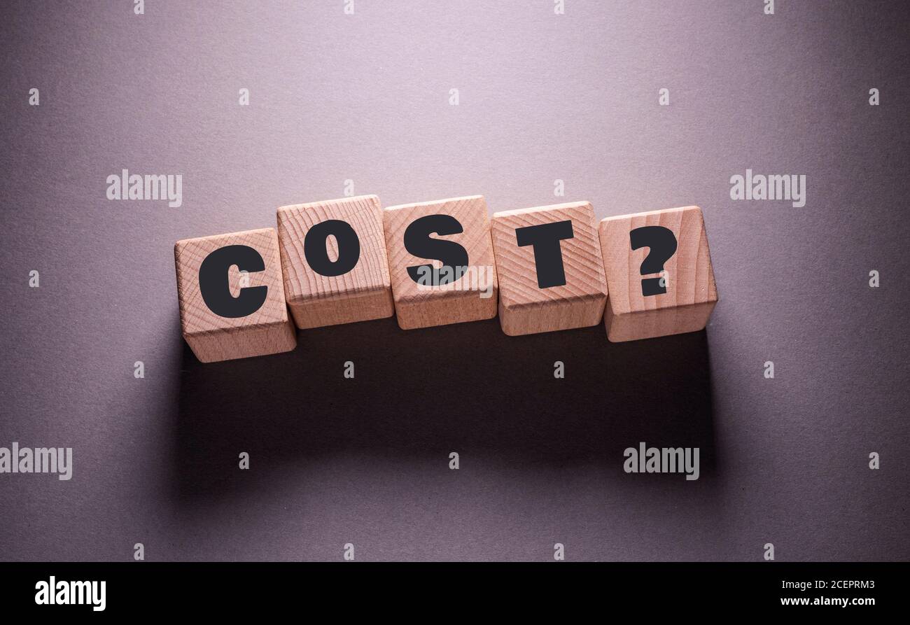 Cost Word Written on Wooden Cubes Stock Photo - Alamy