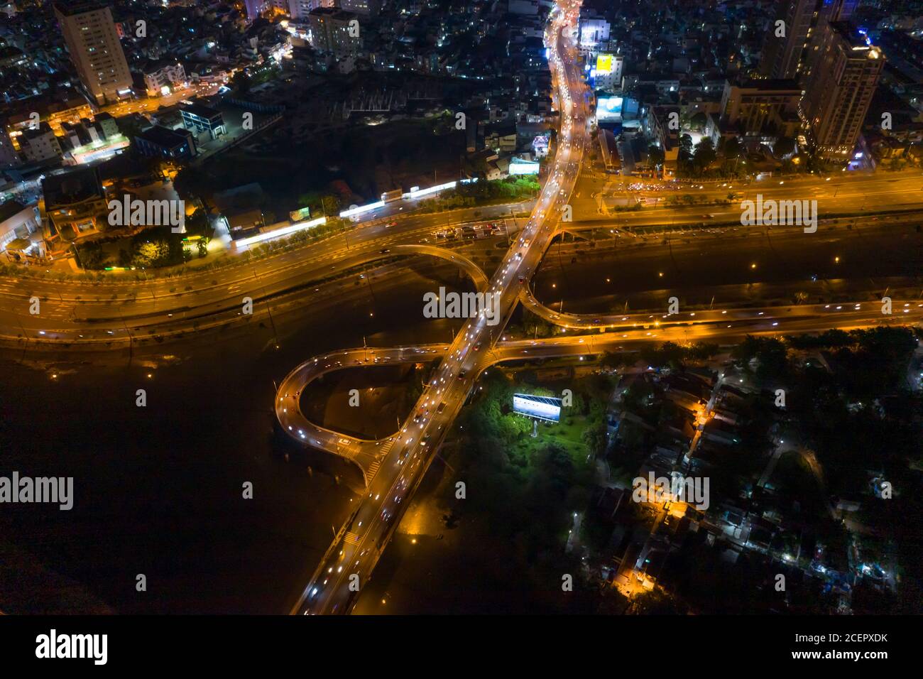 Aerial view of freeway interchange offramp and bridge over canal with ...