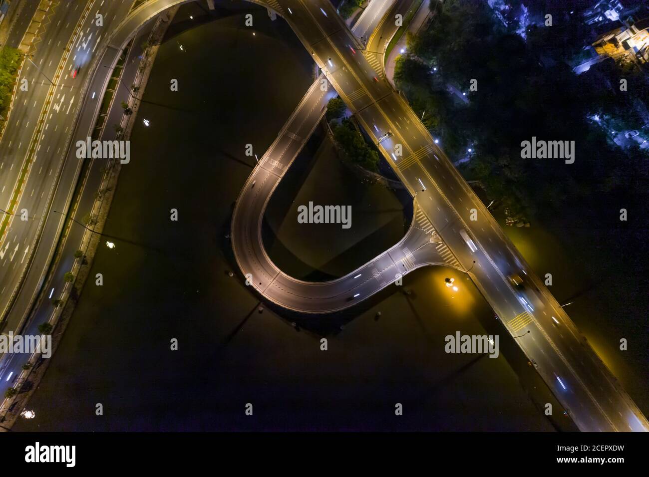 Aerial view of freeway interchange offramp and bridge over canal with ...