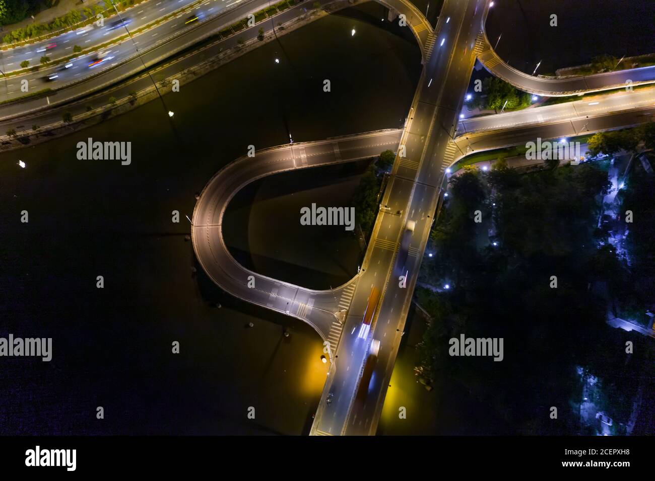 Aerial view of freeway interchange offramp and bridge over canal with ...