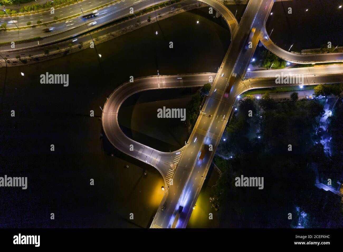 Aerial view of freeway interchange offramp and bridge over canal with ...