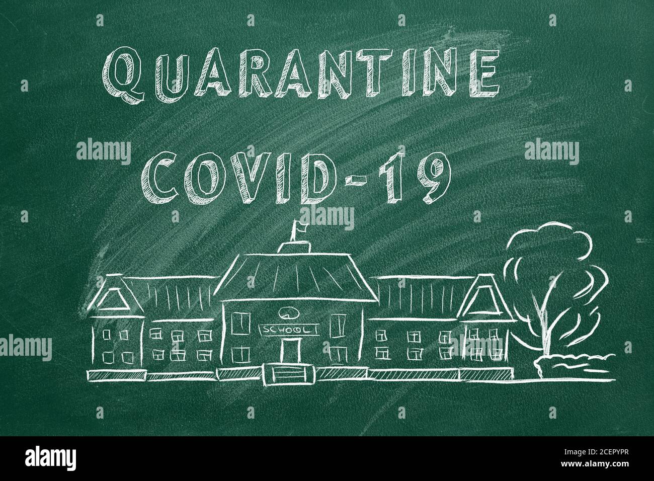 School building and lettering Quarantine COVID-19 on green chalkboard ...