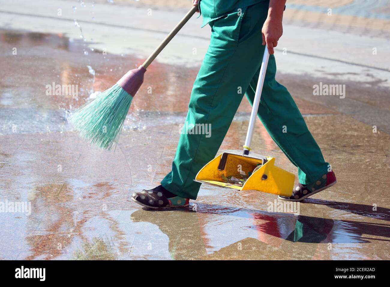 Janitor cleans street hi-res stock photography and images - Alamy