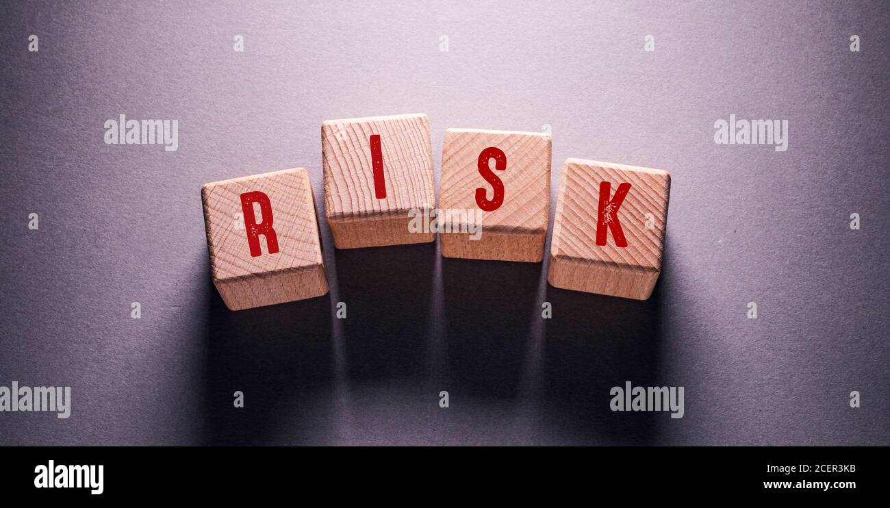 Risk word wooden cubes hi-res stock photography and images - Alamy