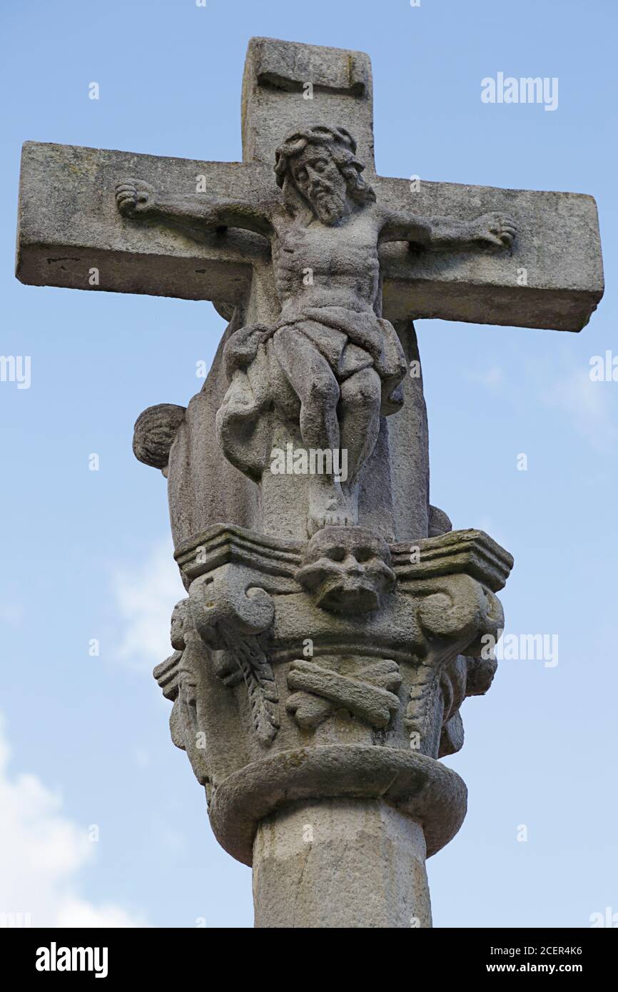 Ancient white stone crucifix with Jesus in blue sky Stock Photo - Alamy