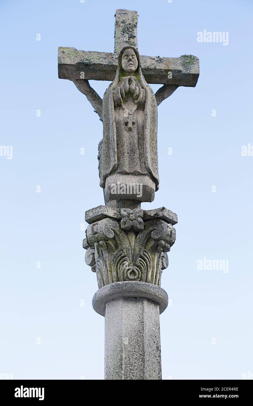 Ancient white stone crucifix with Virgin Mary in blue sky Stock Photo ...