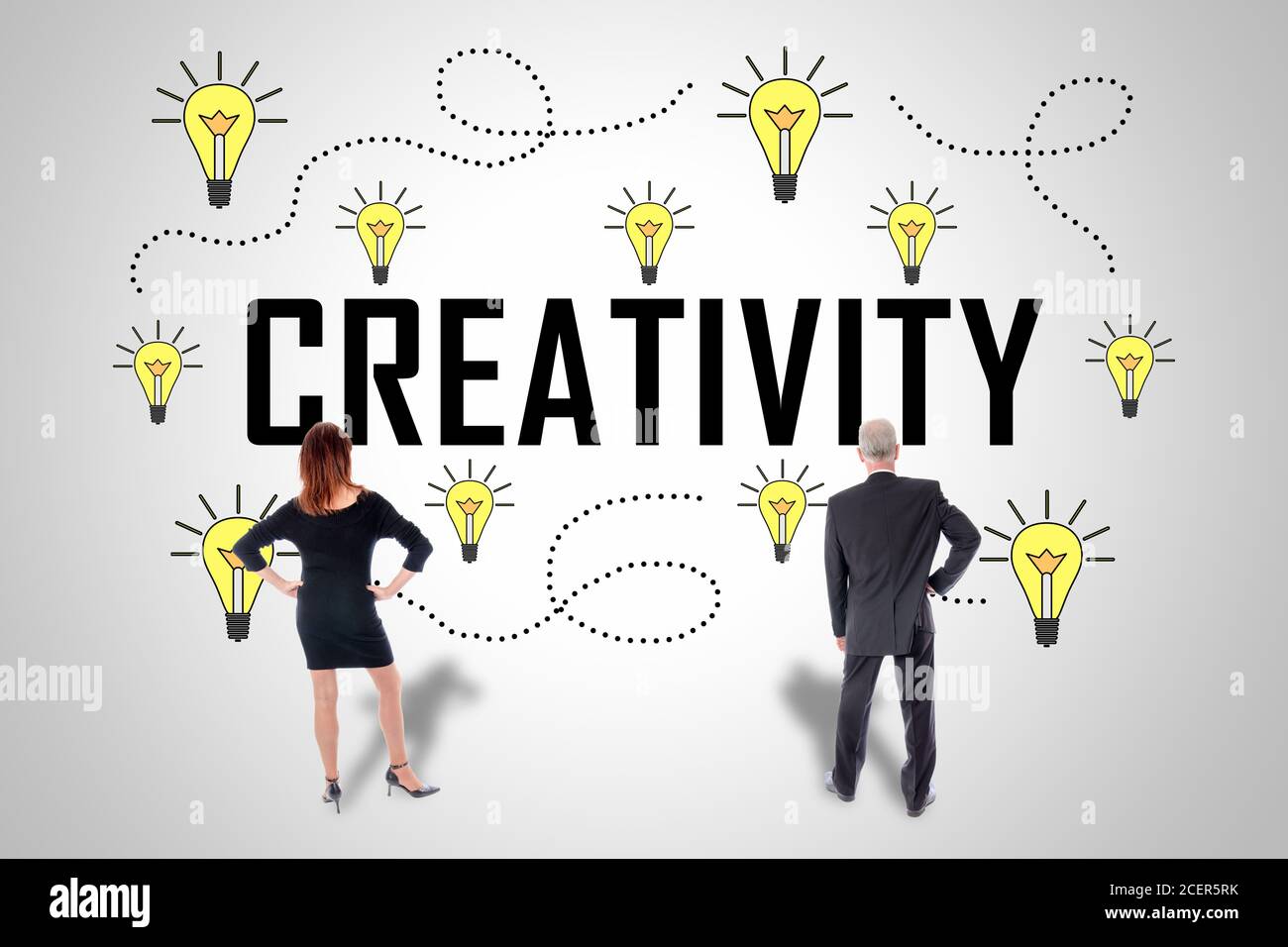 Creativity concept drawn on a wall watched by business people Stock ...