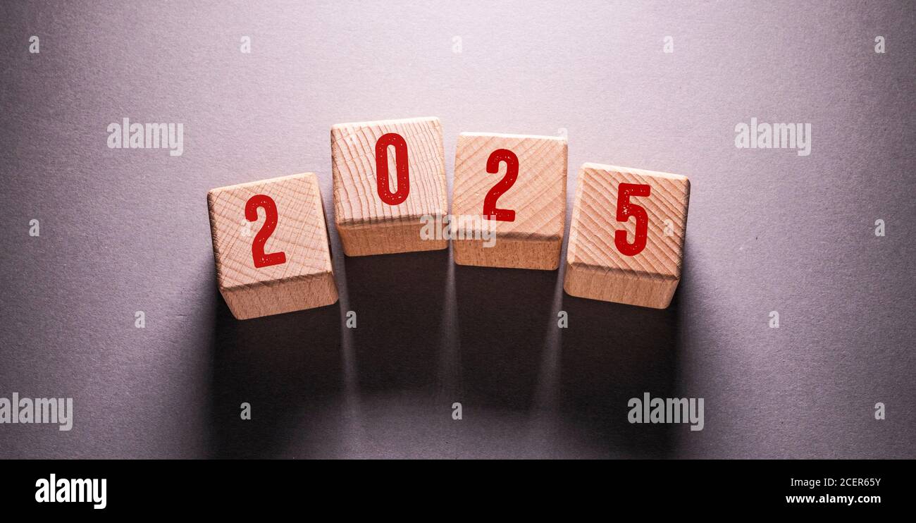 2025 Word Written on Wooden Cubes Stock Photo - Alamy