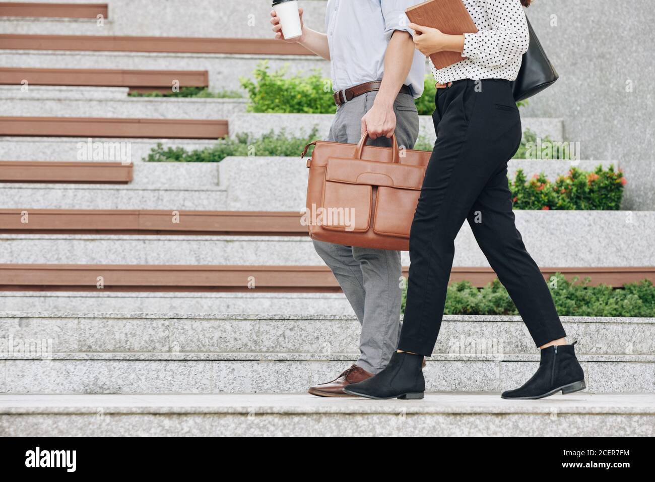 Male entrepreneur discussing walking hi-res stock photography and ...