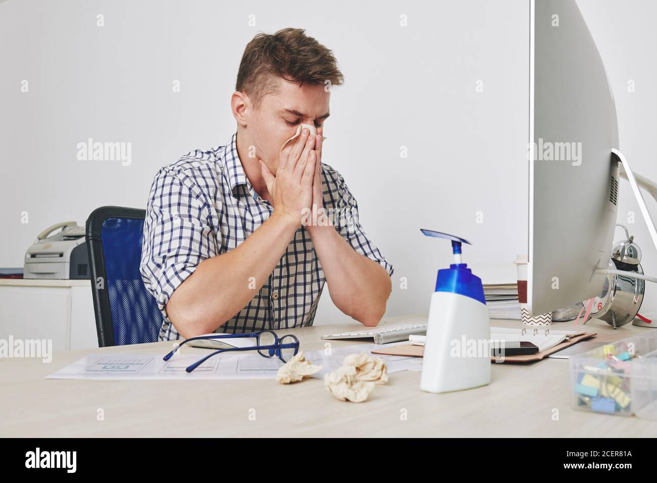 Sick office worker Stock Photo - Alamy